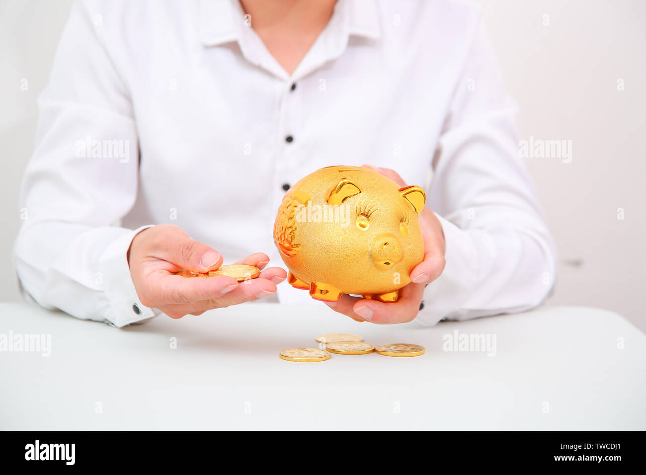 Savings pot gold coins Stock Photo - Alamy