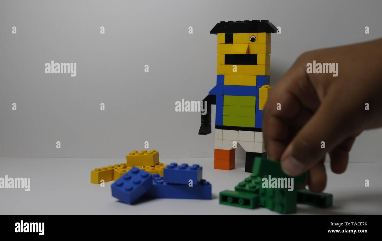 CHILD BUILDING A CHARACTER FROM LEGO Stock Photo - Alamy