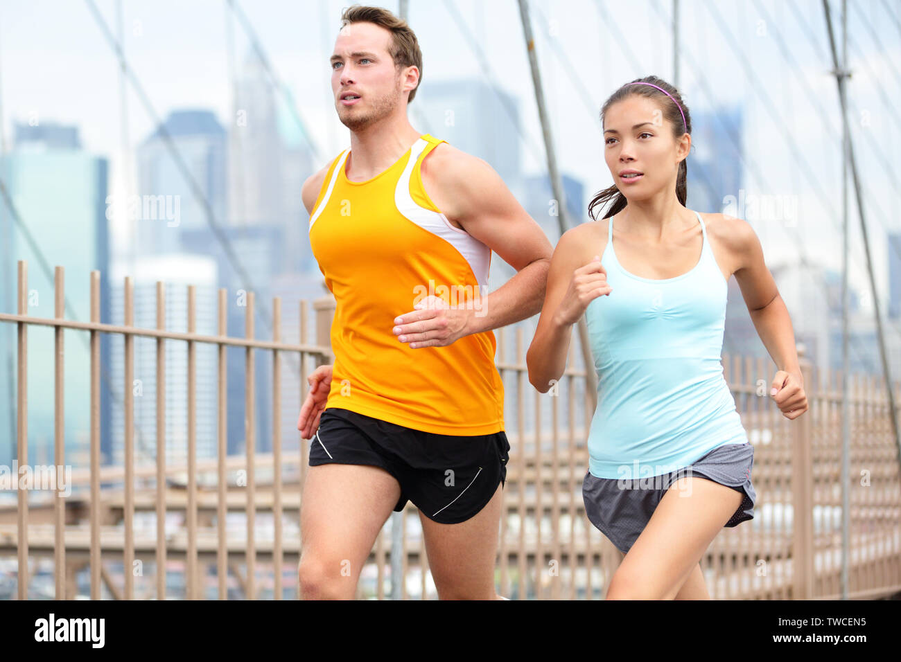 Couple sprinting city hi-res stock photography and images - Alamy