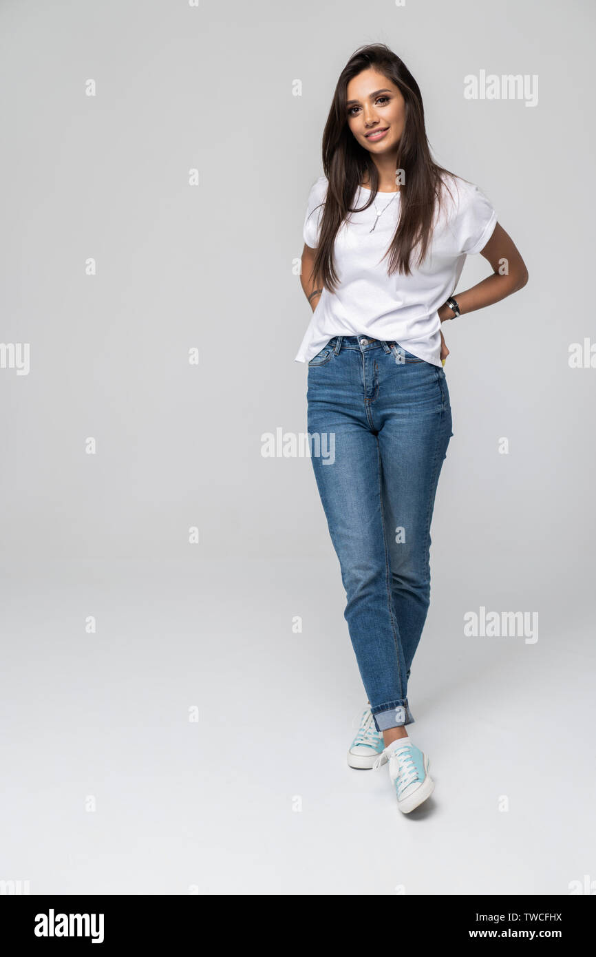 Full length portrait of a smiling pretty woman isolated over white ...