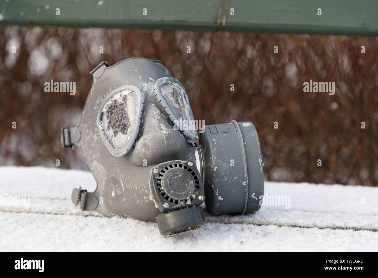 old rubber gas mask on a park bench in winter Stock Photo - Alamy