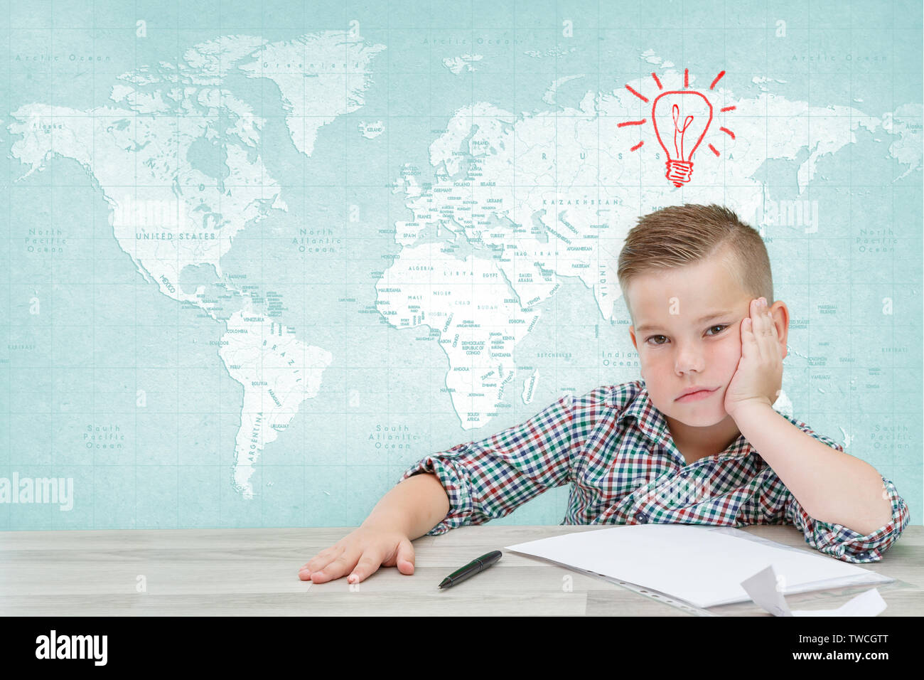 Caucasian school-age boy in a plaid shirt on the background of the ...