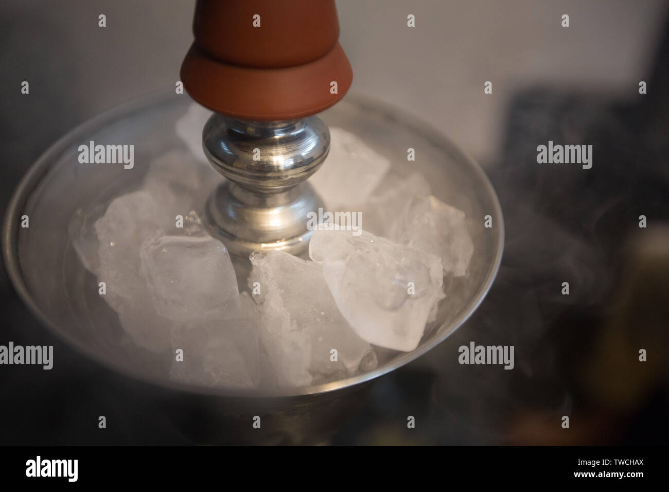 chunks of ice in ice cooler for shisha Stock Photo - Alamy