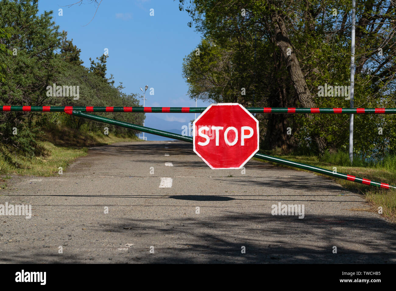 stop sign on the barrier in the daytime Stock Photo - Alamy