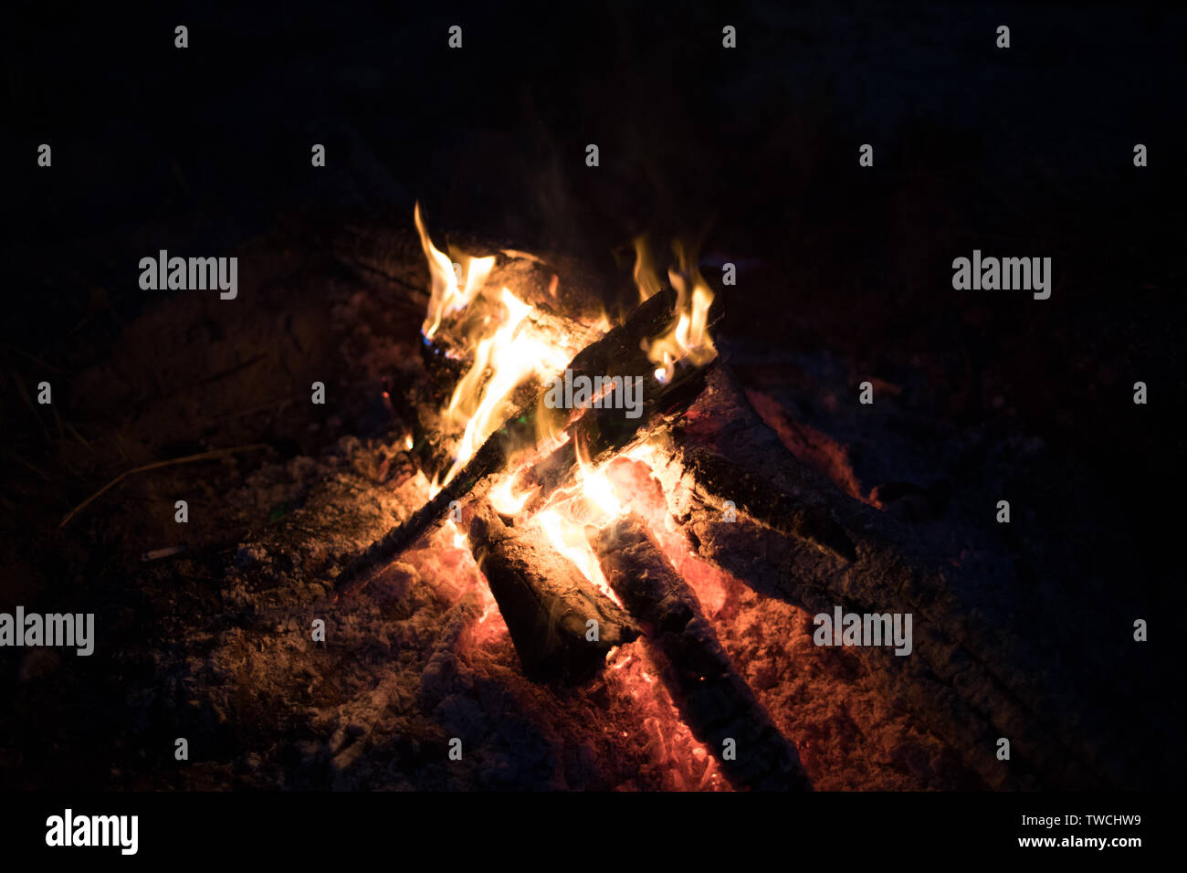 brightly blazing bonfire at night in summer Stock Photo - Alamy