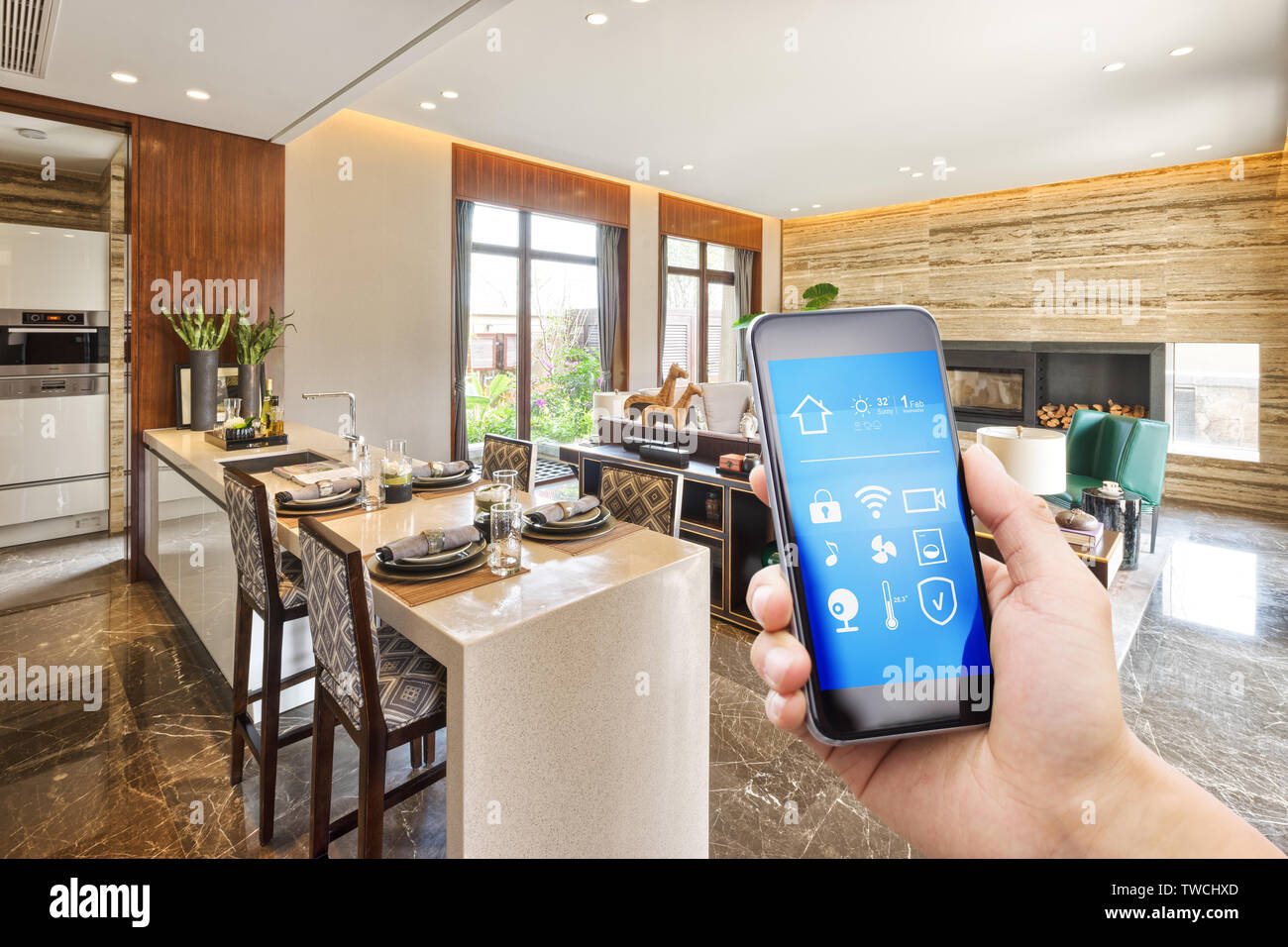 smart phone with smart home with modern dining room Stock Photo - Alamy
