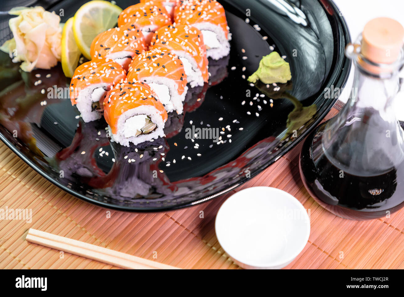 photo of Japanese rolls in a black plate Stock Photo - Alamy