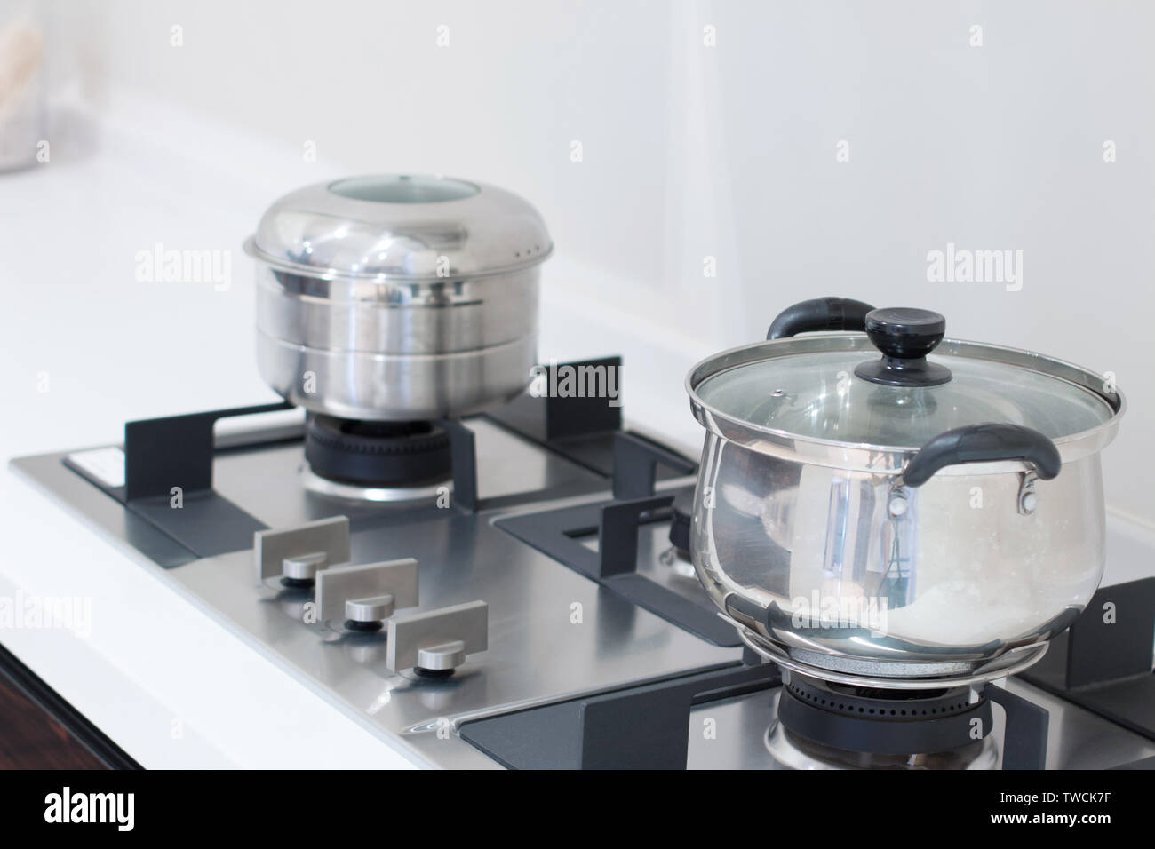Pots on stove hi-res stock photography and images - Alamy