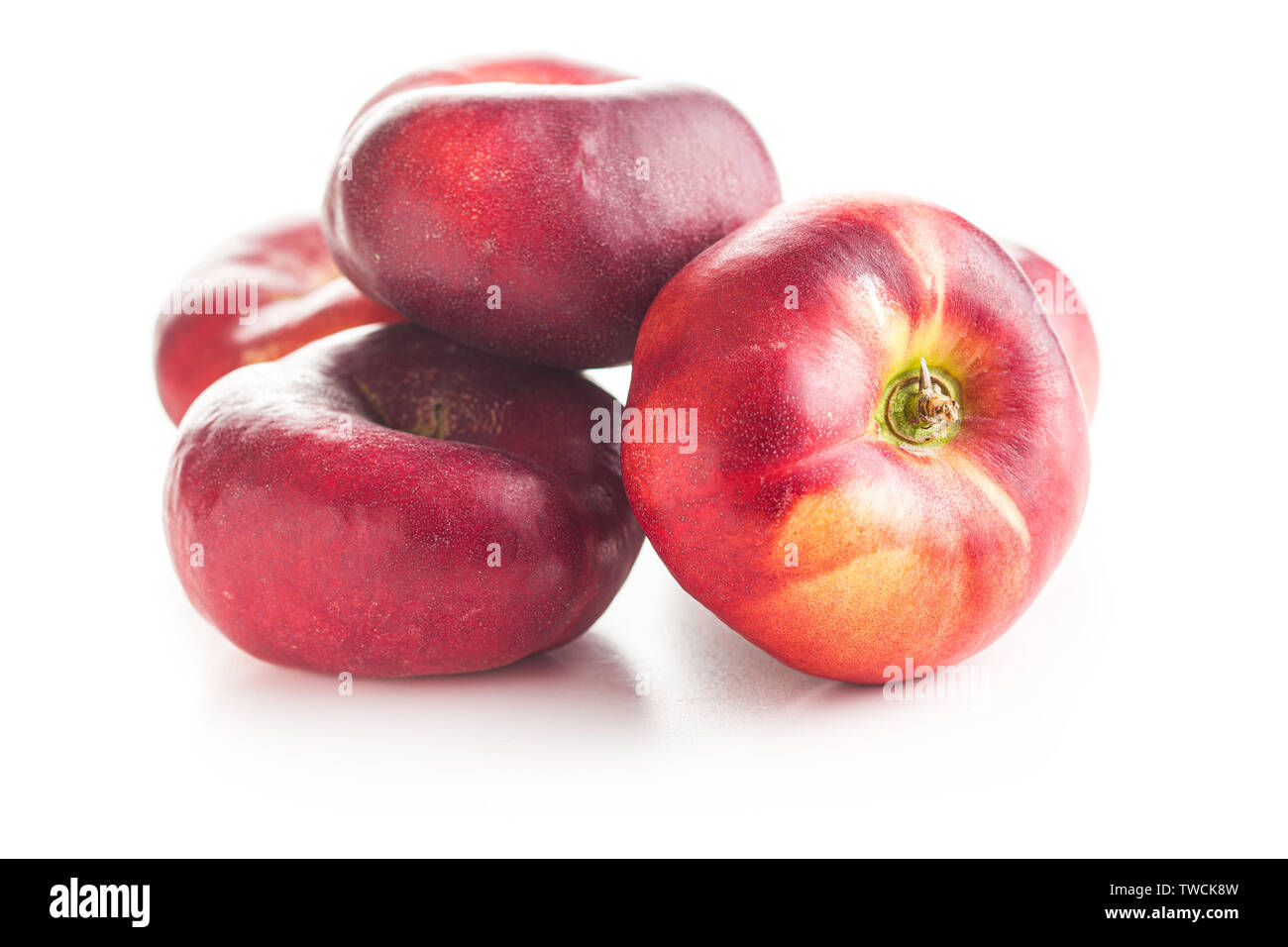 Ripe flat nectarines isolated on white background Stock Photo - Alamy