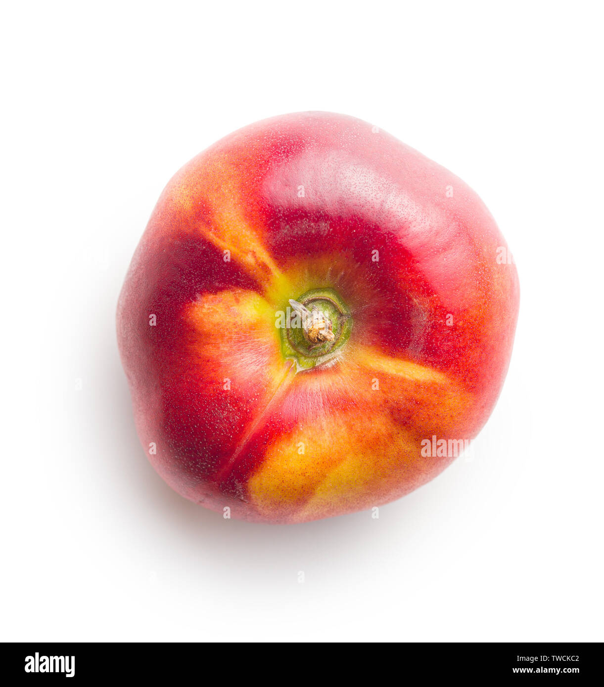Ripe flat nectarine isolated on white background Stock Photo - Alamy