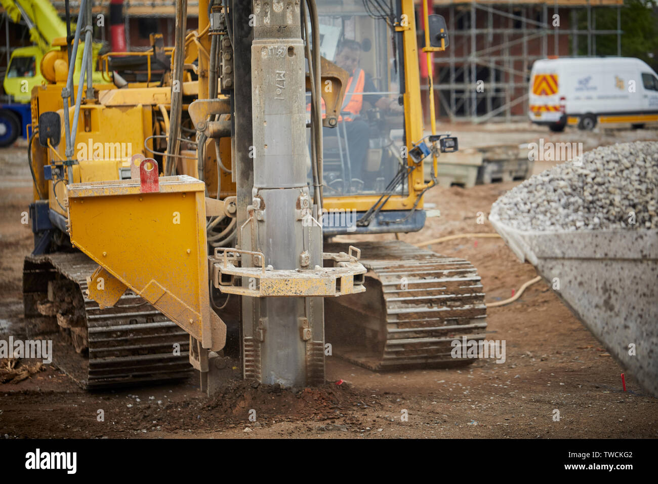 Pile driver rig at work on a building site for new homes in Cheshire ...