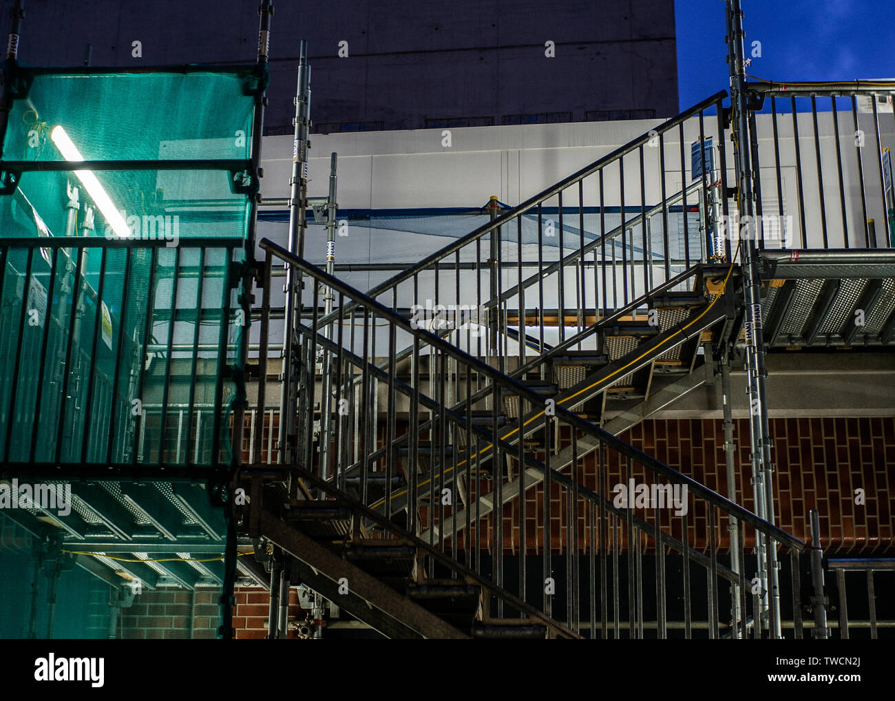 building site scaffold stairway and builders mesh Stock Photo - Alamy