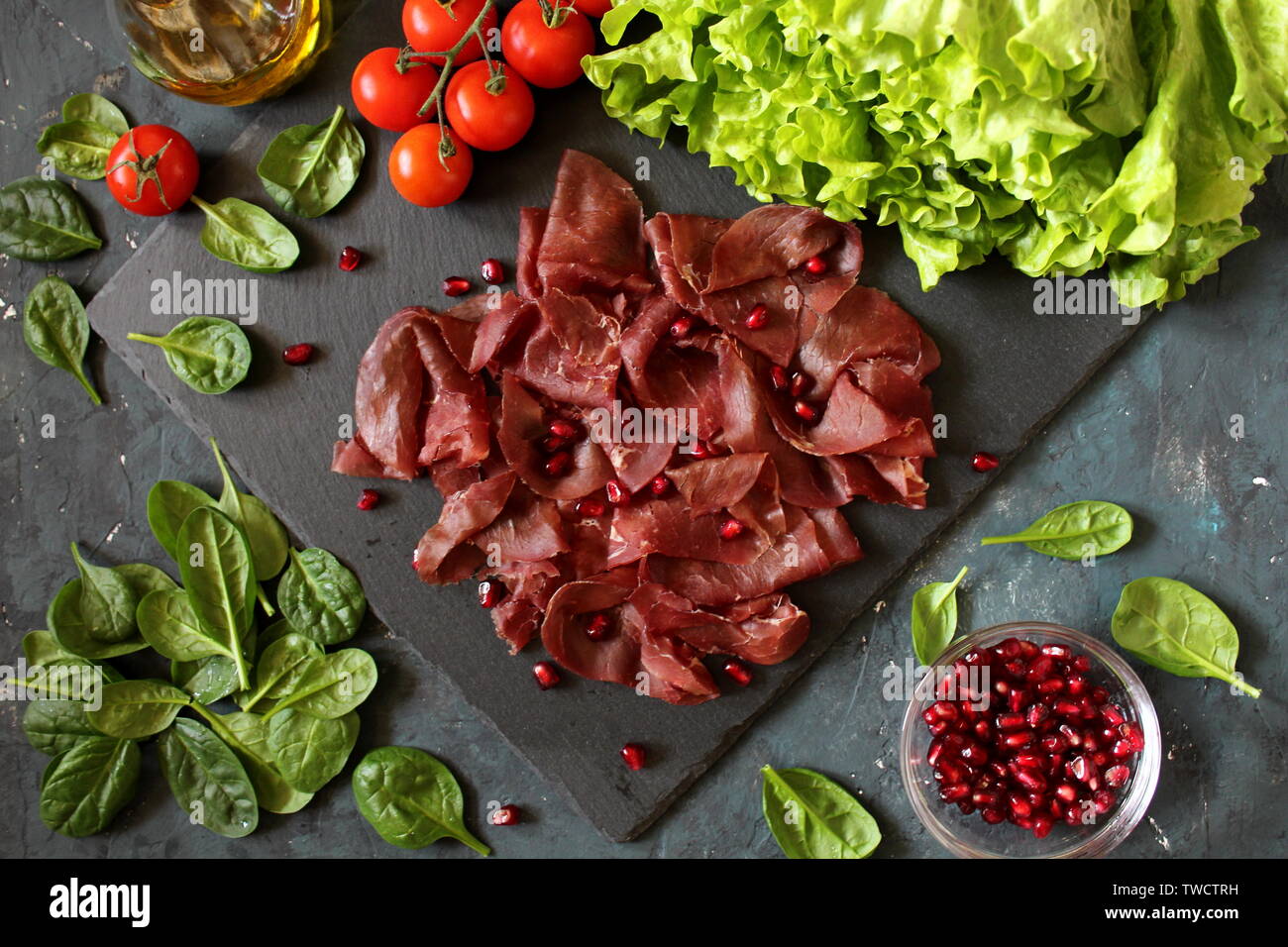 Italian air-dried salted bresaola beef thinly sliced and stone ...