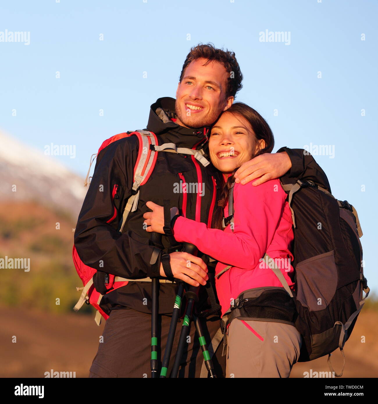 Romantic couple embracing hiking active lifestyle in love. Hikers, man ...