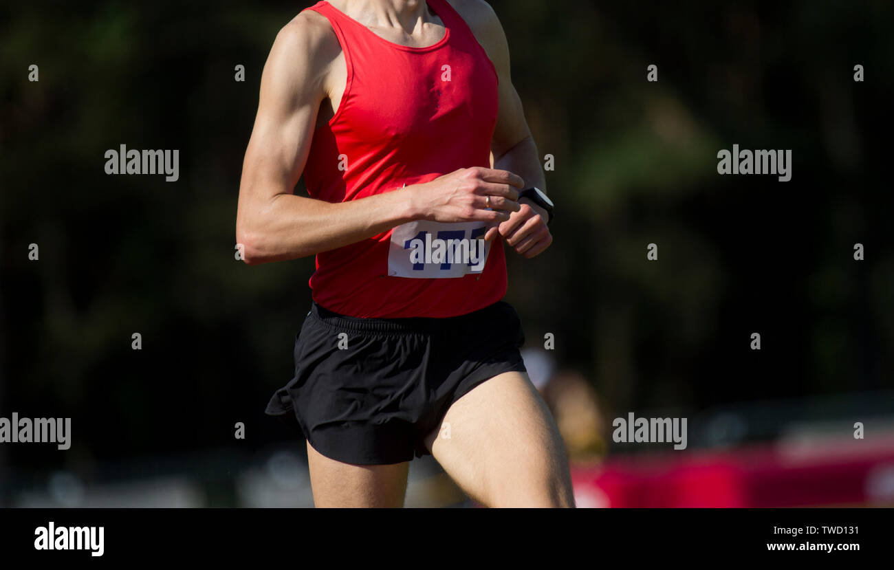 Athletics man running on the track field Stock Photo - Alamy