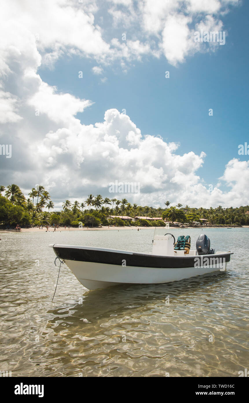 Boat floating near beautiful beach Stock Photo - Alamy