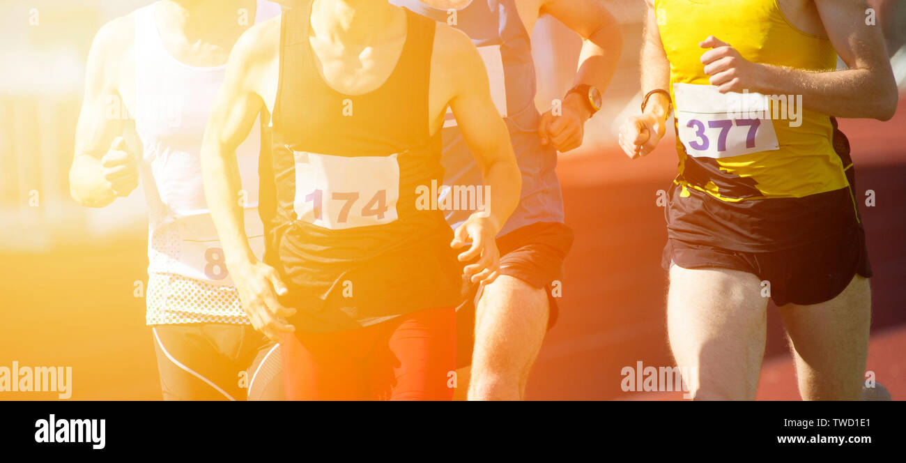 Athletics people running on the track field. Sunny day Stock Photo - Alamy