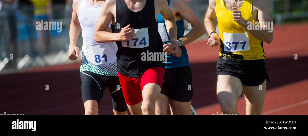 Athletics people running on the track field. Sunny day Stock Photo - Alamy