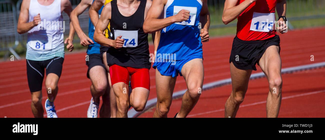 Athletics people running on the track field. Sunny day Stock Photo - Alamy