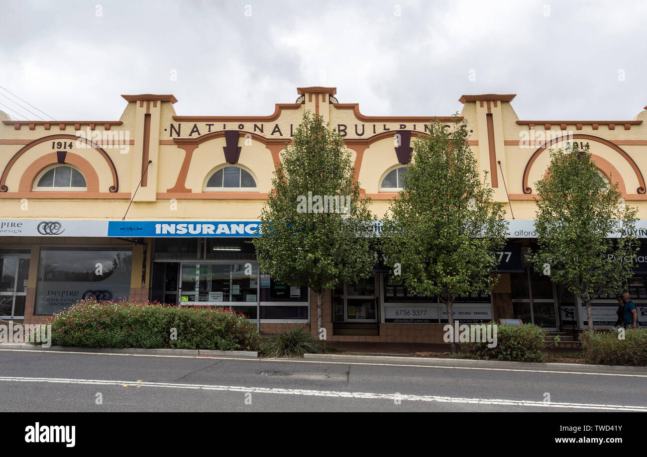 Beautiful facade of a 1914 building with rendered parapet and pediment ...