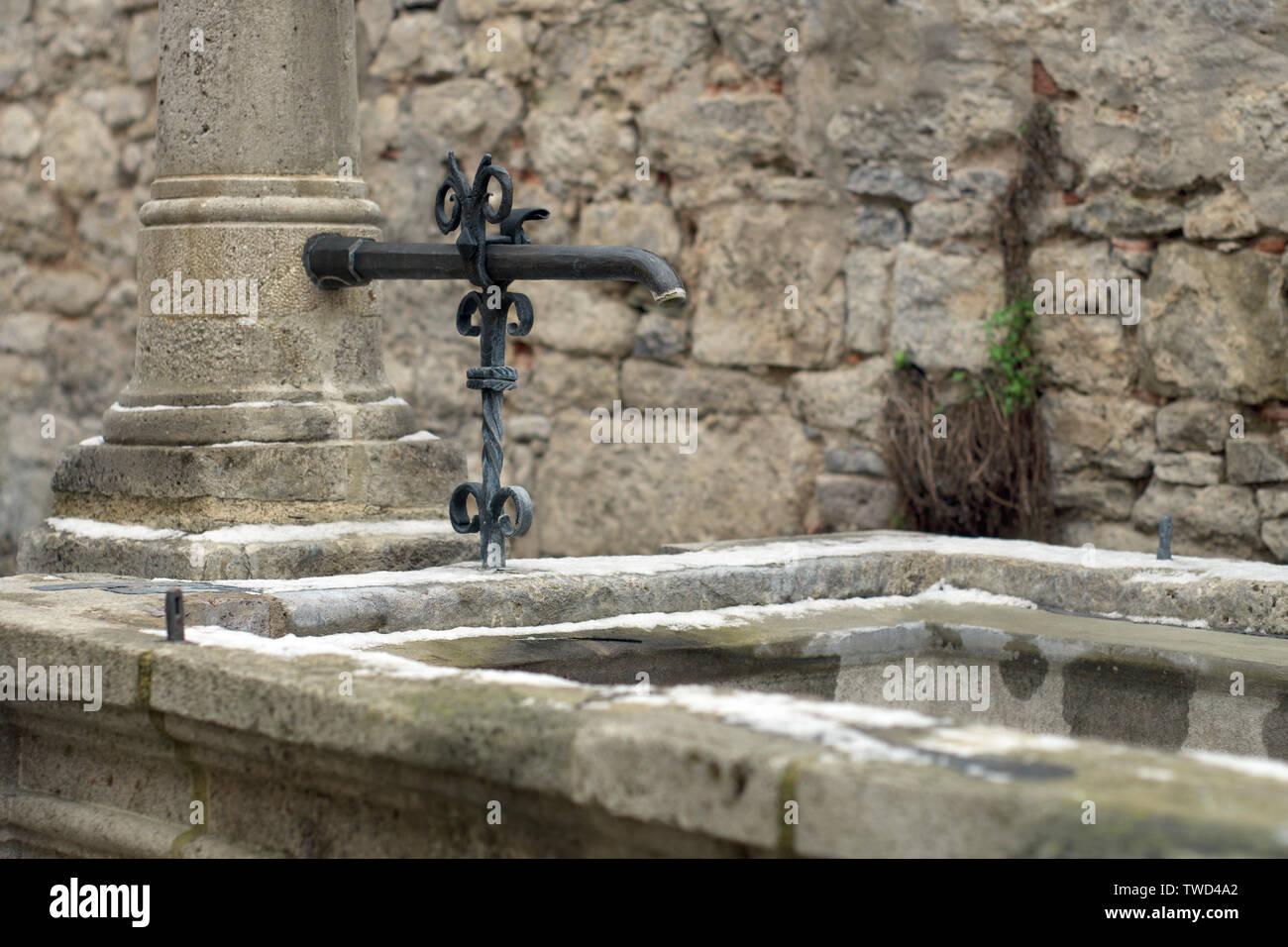 Old city fountain with iron faucet, Germany Stock Photo - Alamy