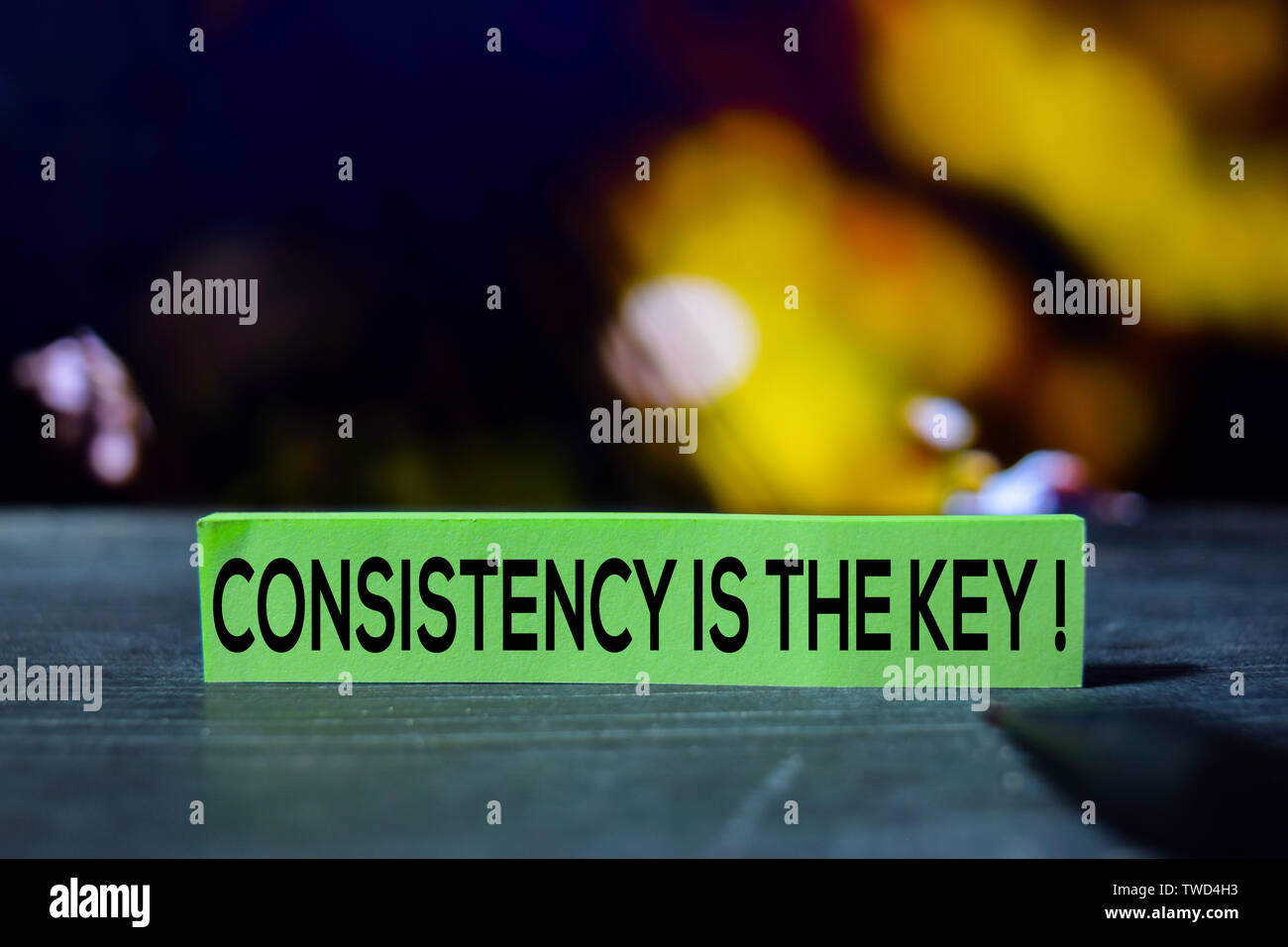 Consistency is the Key on the sticky notes with bokeh background Stock ...