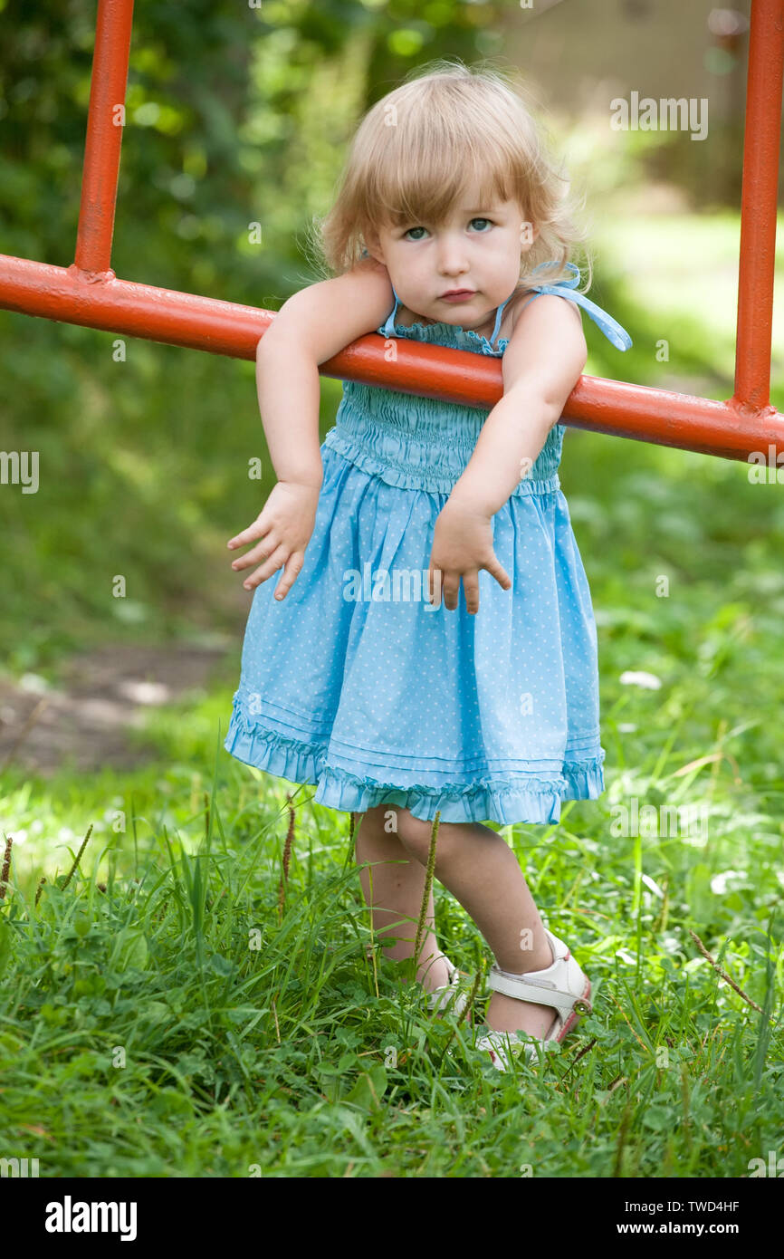 pretty kid caucasian girl in beautiful blue dress on summer outdoor ...