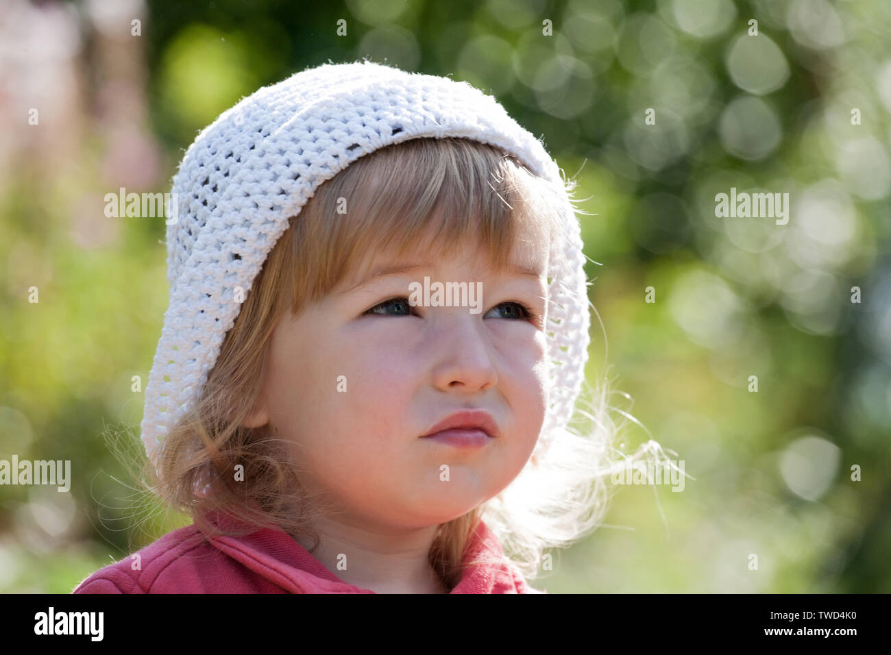 little kid pretty caucasian girl in white hat face portrait closeup ...