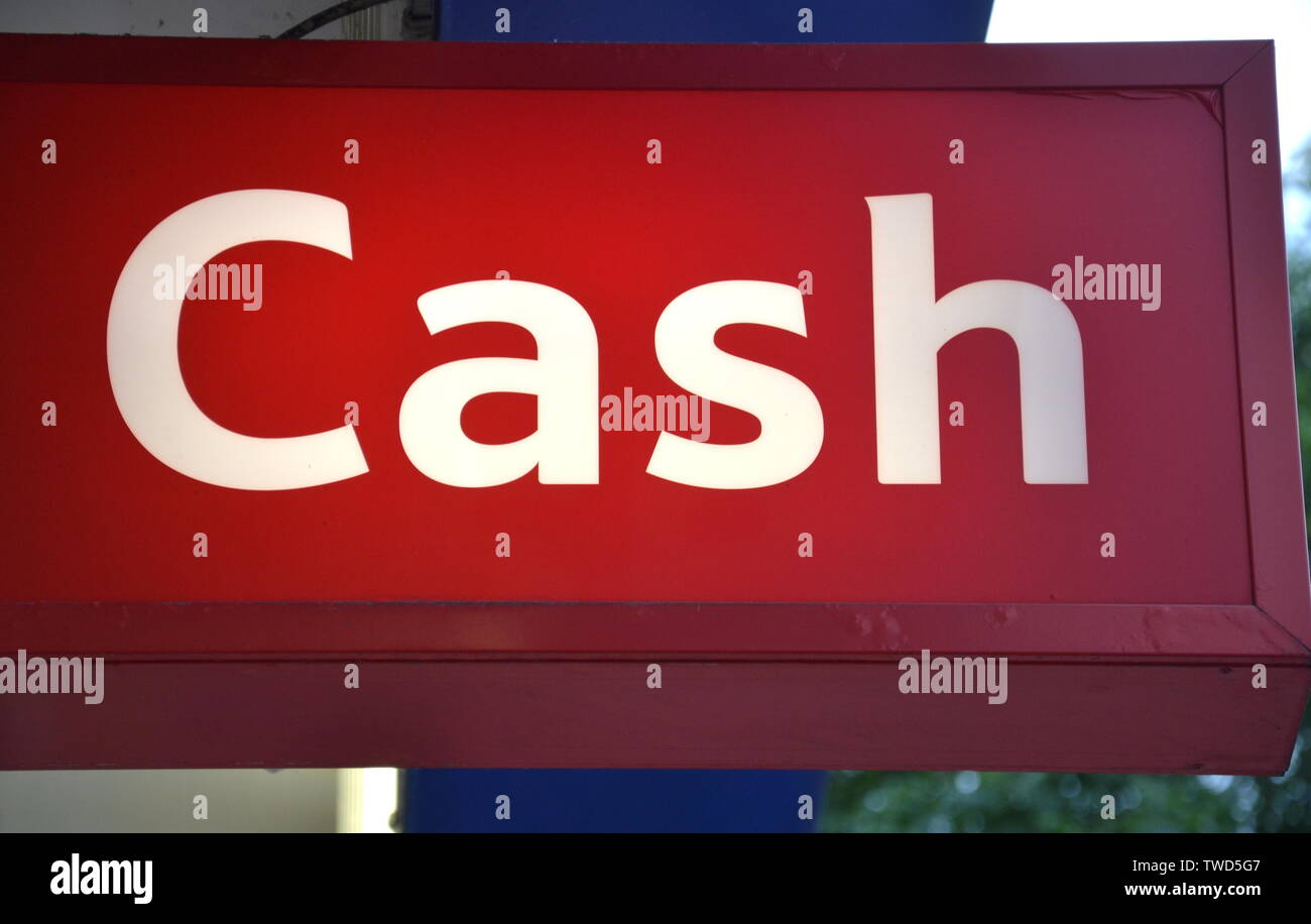 A 'Cash' sign above an atm in Manchester, uk Stock Photo - Alamy