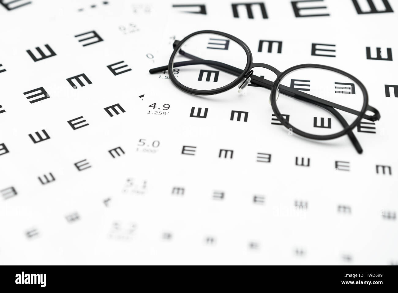 Black glasses and visual meter on white background Stock Photo - Alamy