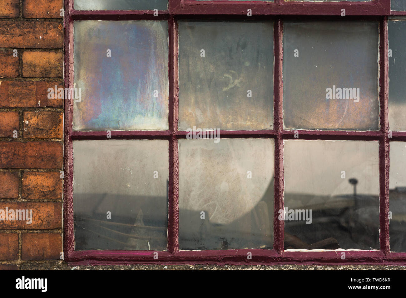 Reflections in set of old but shiny rectangular glass window panes set ...