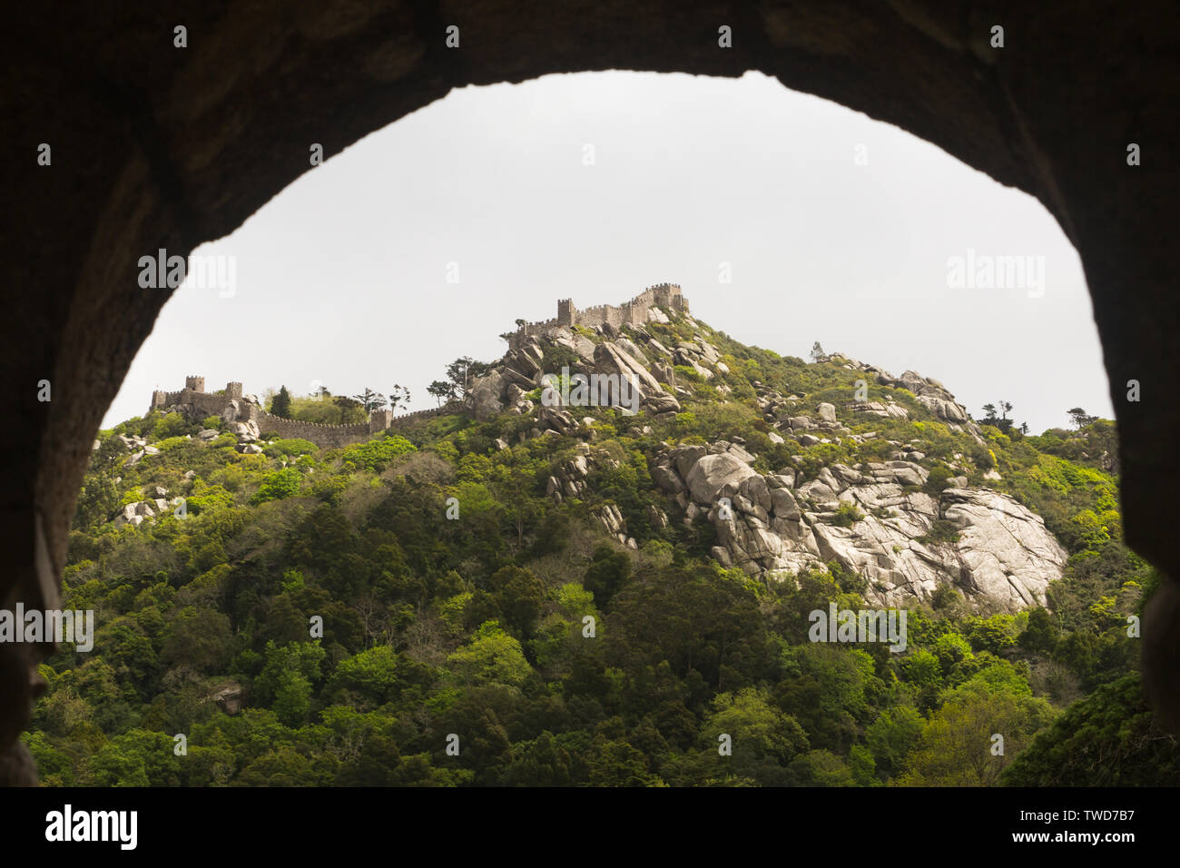 View of the Castle of The Moors (Castelo dos Mouros) through arch from ...