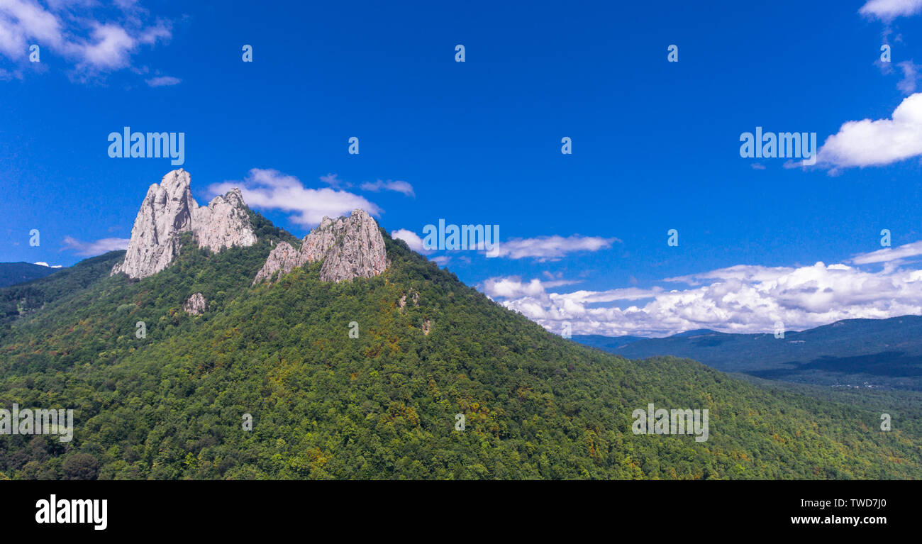 The mountainous landscape. Aerial view. Rock massif among the deciduous ...