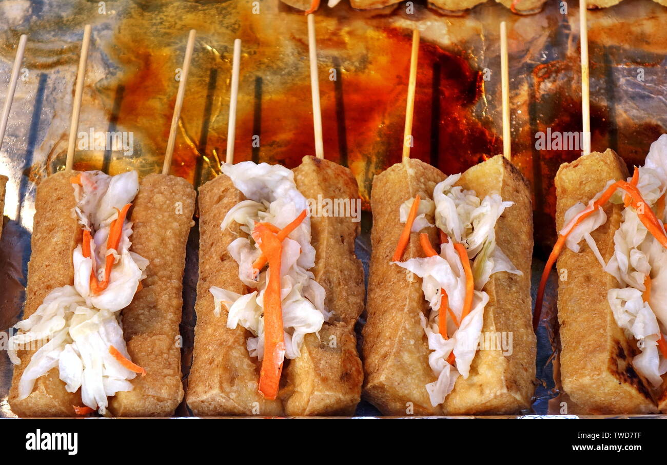 Stinky fermented tofu with pickled cabbage and hot sauce is popular in ...