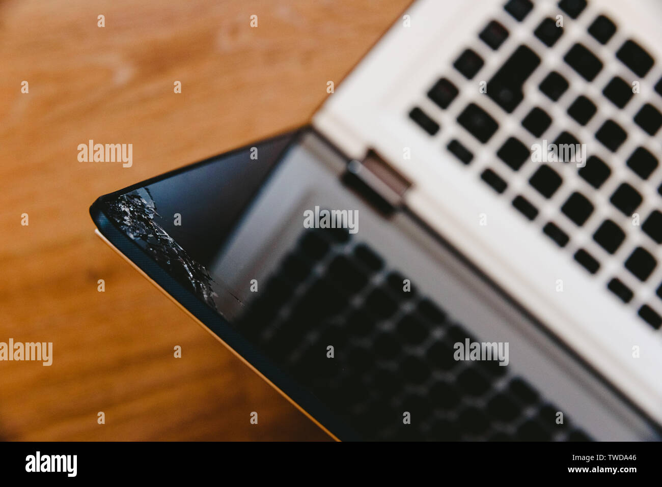 Laptop computer screen with broken glass by accident Stock Photo - Alamy