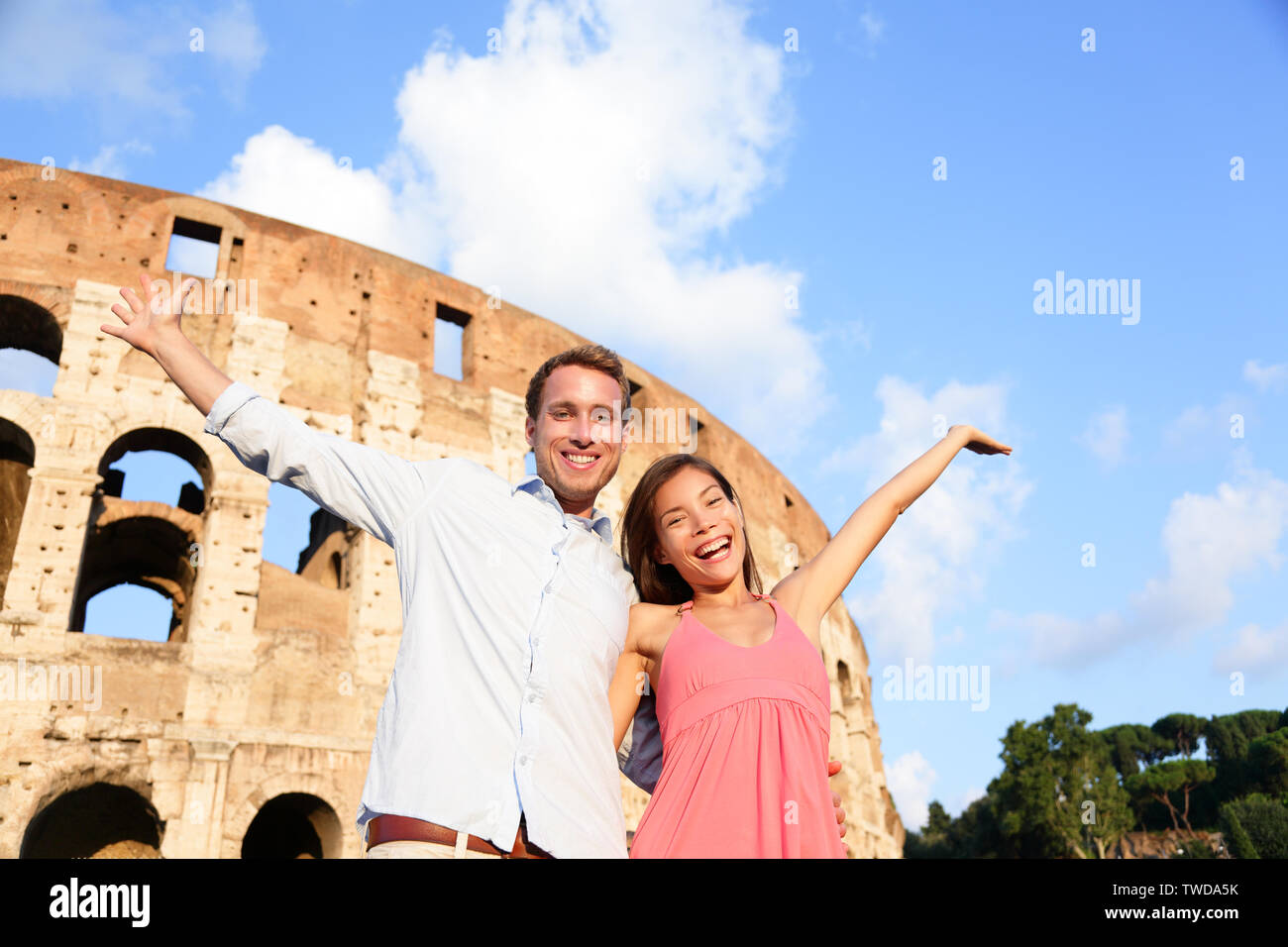 Rome couple happy by Colosseum travel fun cheering. Romantic couple ...