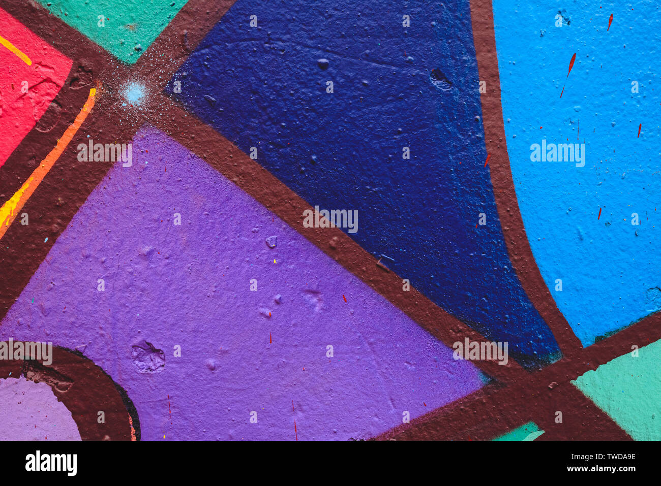 Detail of an anonymous street graffiti with many colors, cheerful urban ...