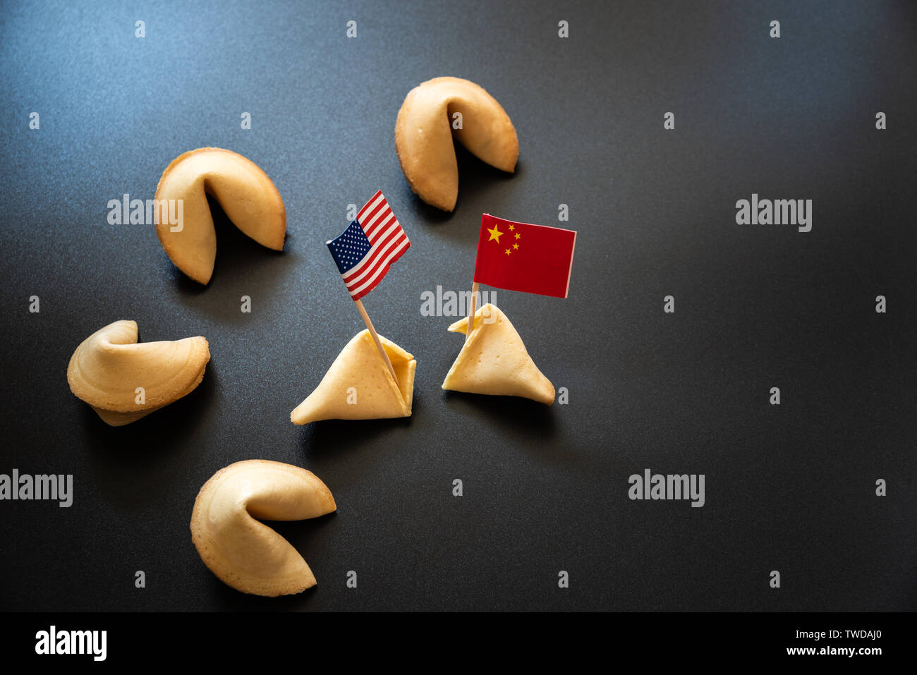Chinese fortune cookies next to American flag, concept of international ...