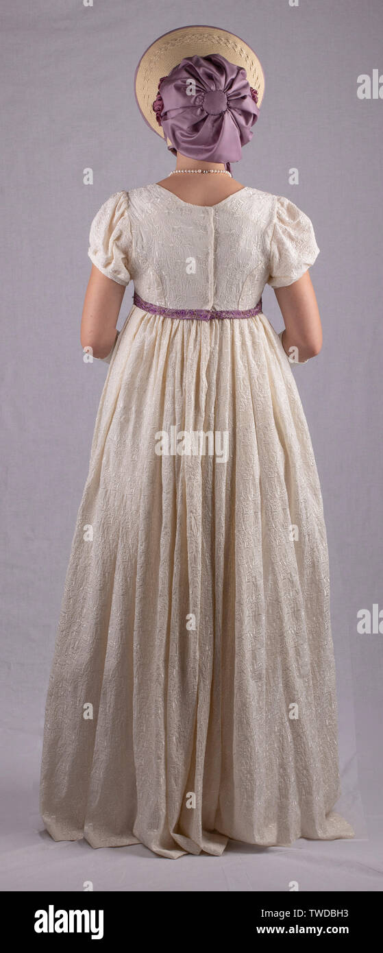 Regency woman in cream dress on studio backdrop Stock Photo - Alamy