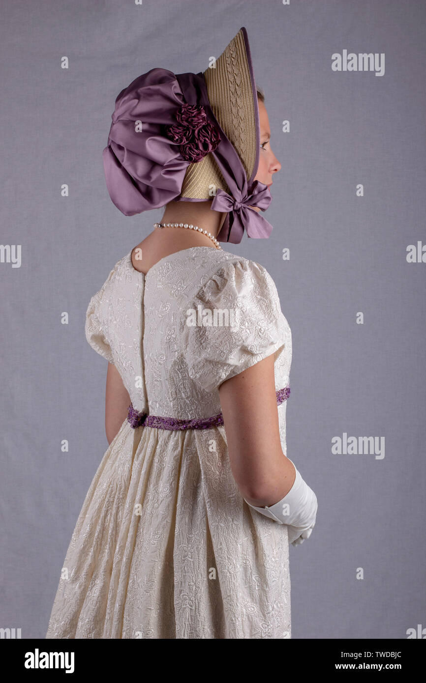 Regency woman in cream dress on studio backdrop Stock Photo - Alamy