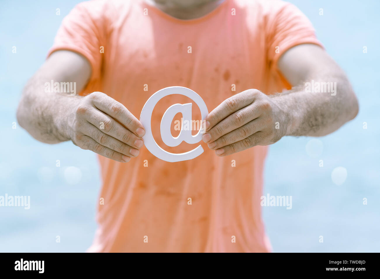 Happy Man Holding Email Sign Over Sea Background. Concept for email ...