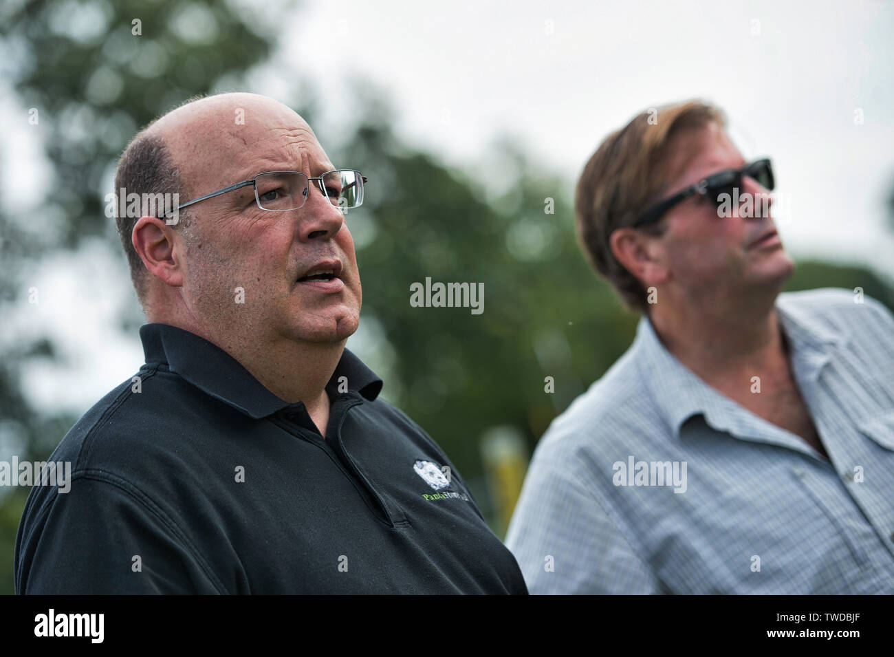 As he gives them a tour of the settlement hi-res stock photography and ...