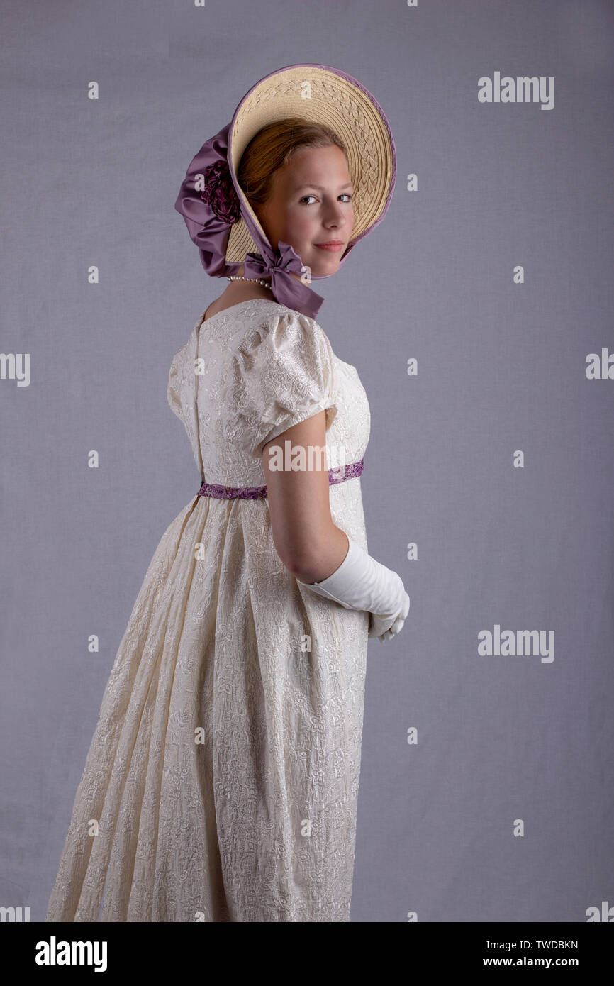 Regency woman in cream dress on studio backdrop Stock Photo - Alamy