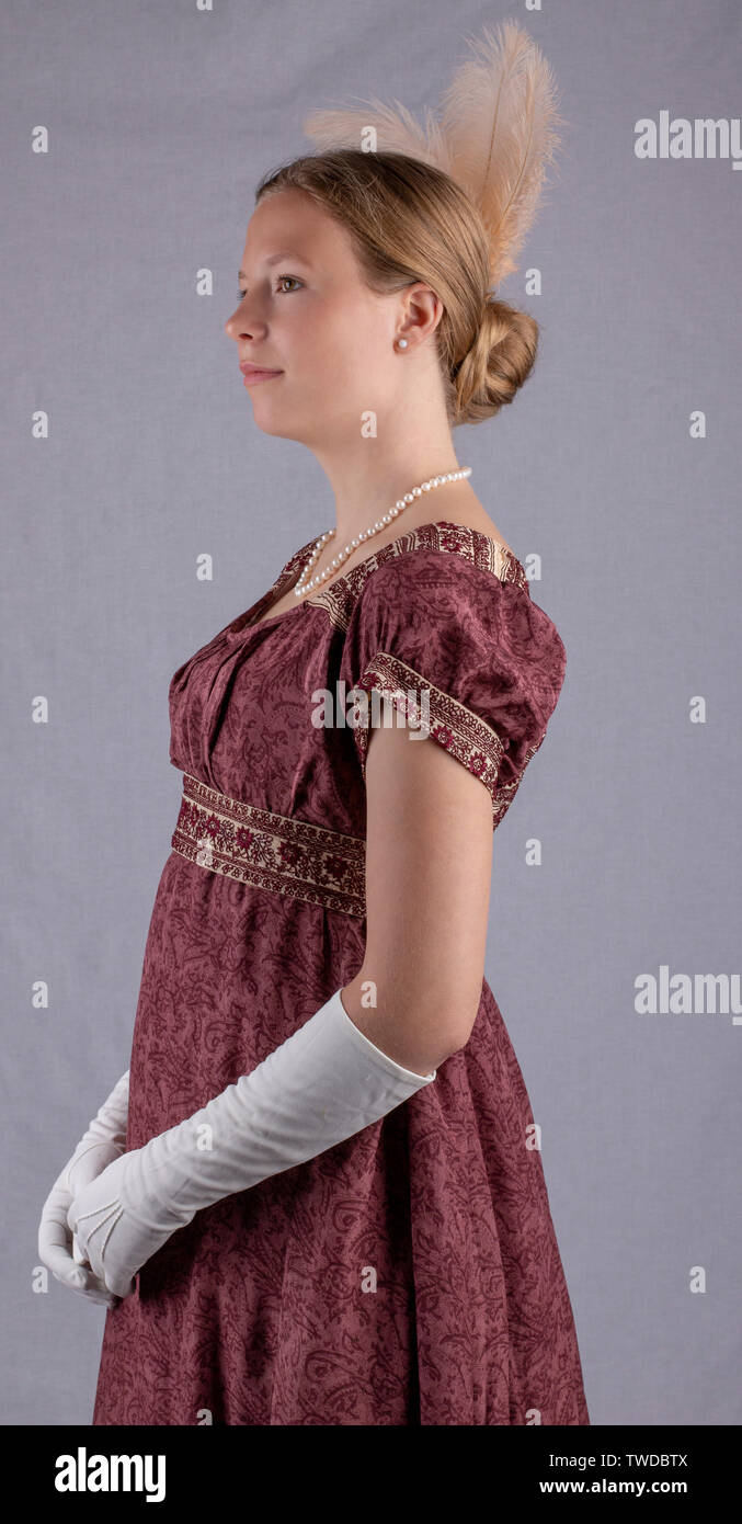 Regency woman in red evening dress with feathers in her hair Stock Photo - Alamy
