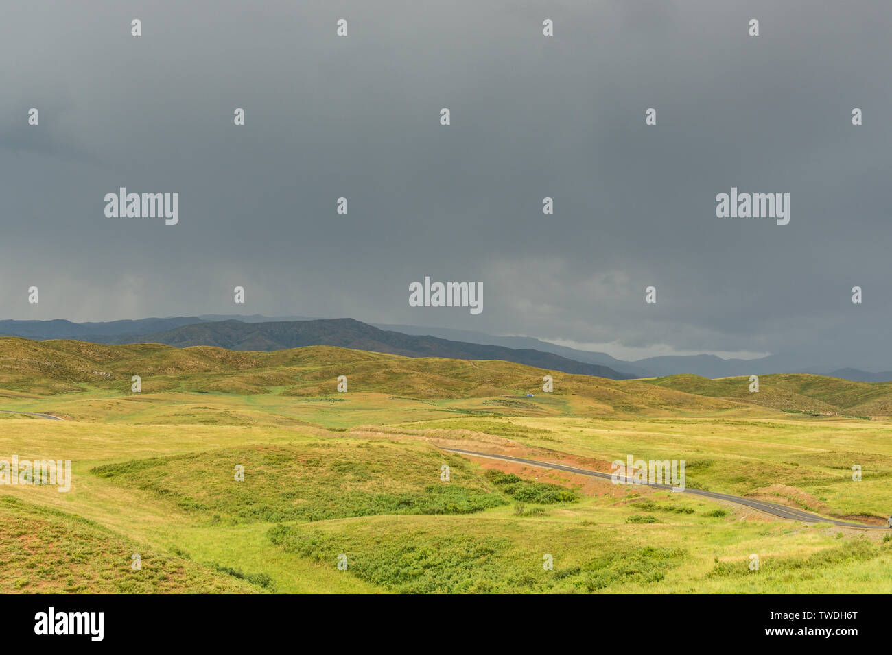 Hillside prairie villages under cloudy clouds Stock Photo - Alamy