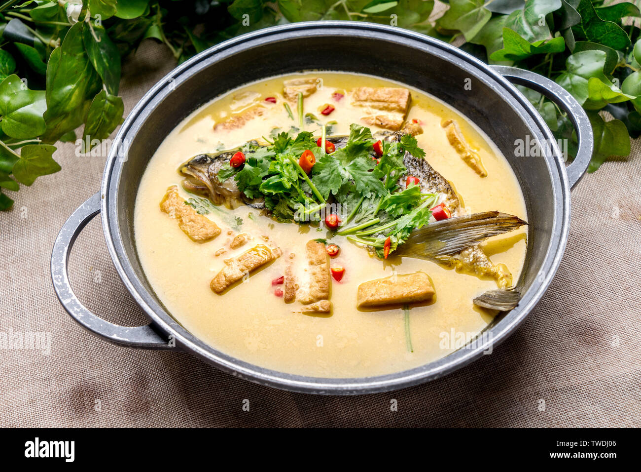 Chinese traditional cuisine fish head stewed tofu Stock Photo - Alamy