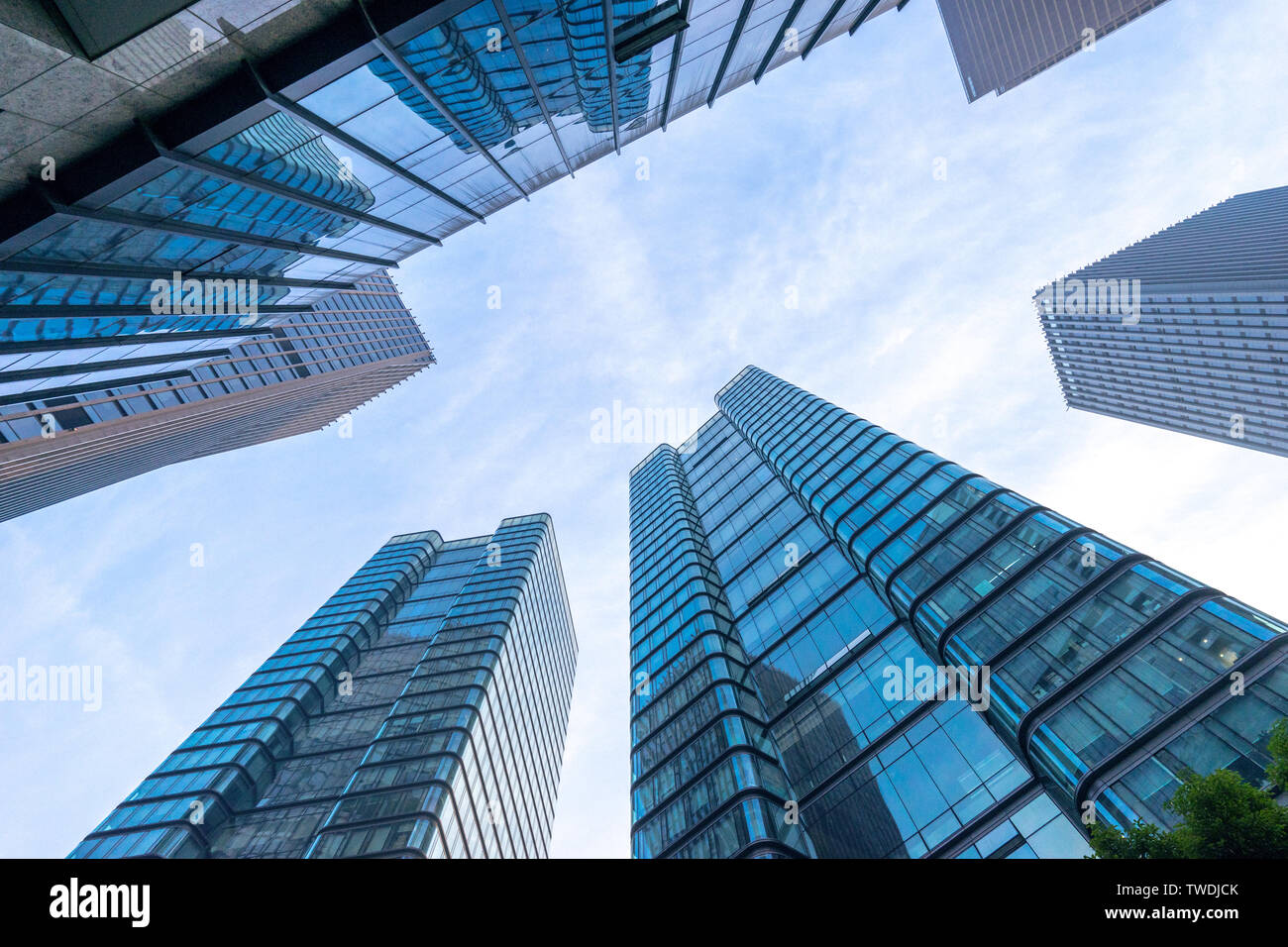 look up modern office building in cloud sky Stock Photo - Alamy