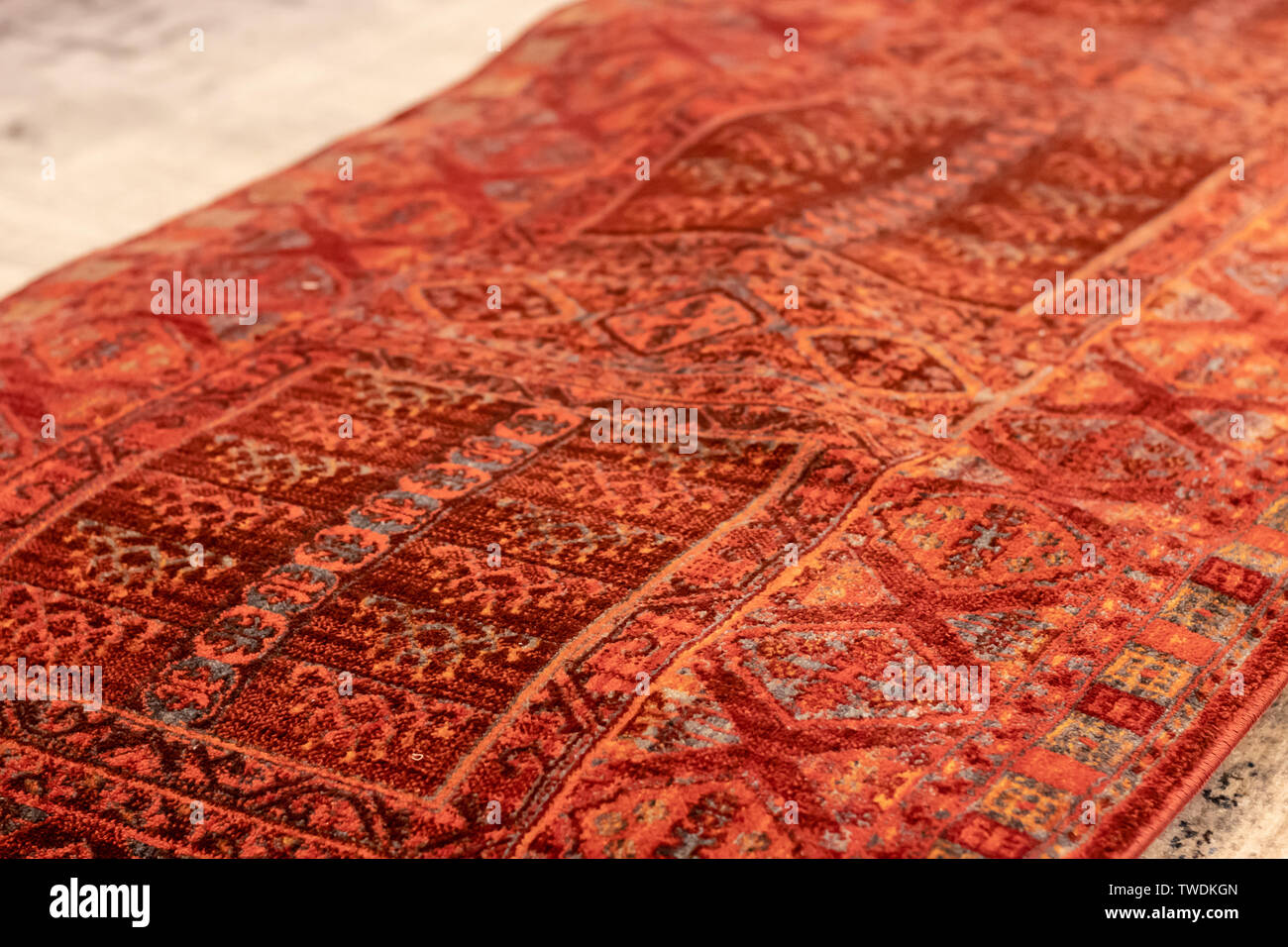 good looking traditional handmade red carpet. photo has taken under ...