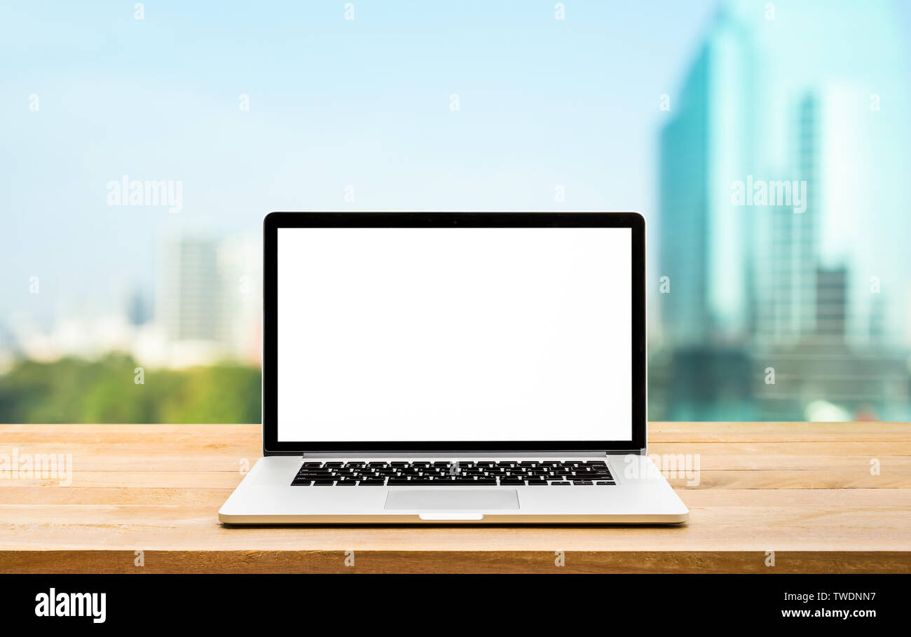 Modern computer,laptop with blank screen on wood table with office ...
