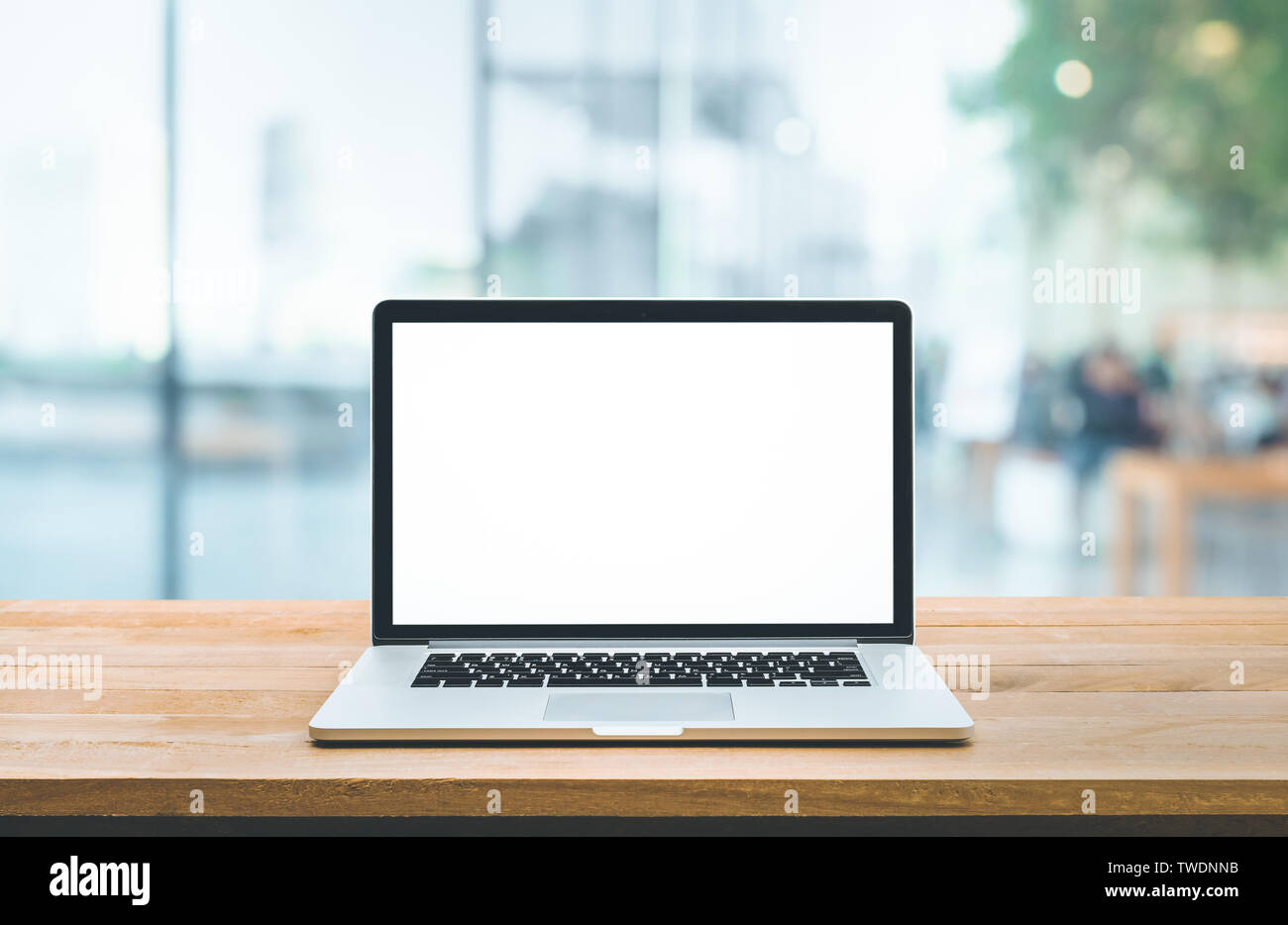 Modern computer,laptop with blank screen on counter bar(retail store ...